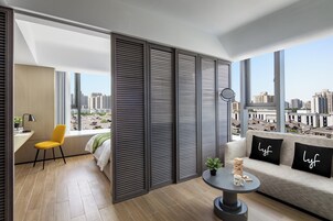 Apartamento, 1 quarto | Área de estar | TV LCD, pebolim