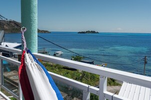 Quarto Quádruplo Superior, 2 camas de casal, vista para o oceano | Terraço/pátio interior