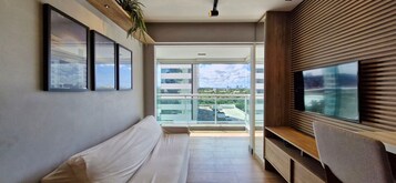 Apartamento conforto | Área de estar | Smart TV 40 polegadas com canais digitais, Netflix