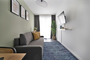 Apartamento Deluxe, 1 quarto | Sala de estar