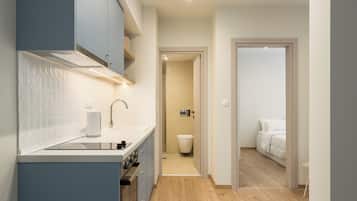 Apartamento, 1 quarto | 1 quarto, secretária, secretária adequada para computadores portáteis