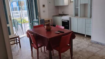 Apartamento Comfort | Sala de estar | Televisor