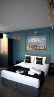 Quarto com cama, mesa de cabeceira, guarda-roupa e pintura de ruínas antigas.