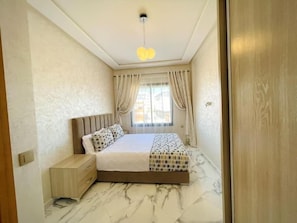 Apartamento conforto, vista para o jardim | Cortinas blackout, Wi-Fi de cortesia