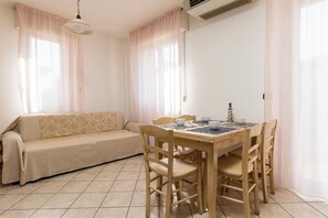 Apartamento Deluxe | Sala de estar
