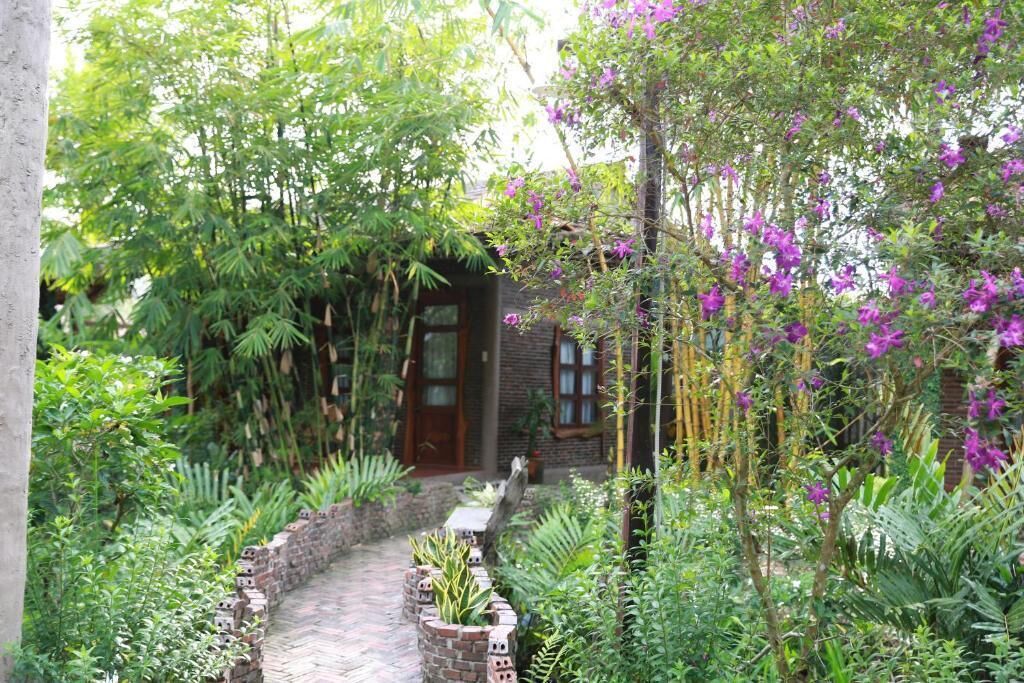 Quarto Triplo Deluxe, vista para o jardim | Terraço/pátio interior