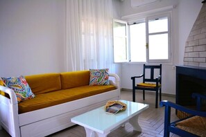 Apartamento Superior | Sala de estar | Televisor 