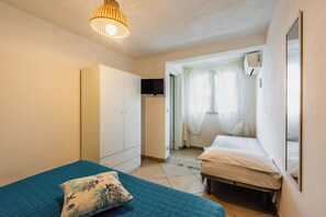 Apartamento básico, 2 quartos (Apartment) | Berços (sobretaxa), Wi-Fi de cortesia, roupa de cama