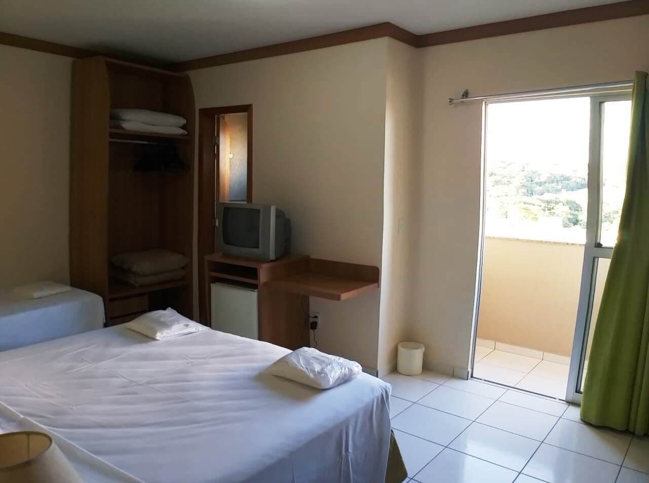 Suíte básica | Cortinas blackout, Wi-Fi de cortesia, roupa de cama