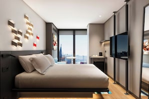Quarto de hotel moderno com uma cama grande, televisão e vista para a cidade.