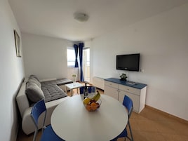 Apartamento Clássico, varanda | Sala de estar