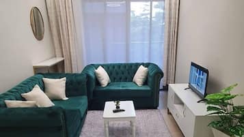 Apartamento, 1 quarto, acessível, fumadores | Sala | Livros