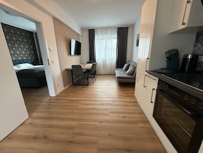Apartamento standard | Área de estar | TV de tela plana, pisos aquecidos