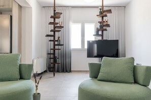 Suíte grand, 2 quartos, vista para o mar | Área de estar