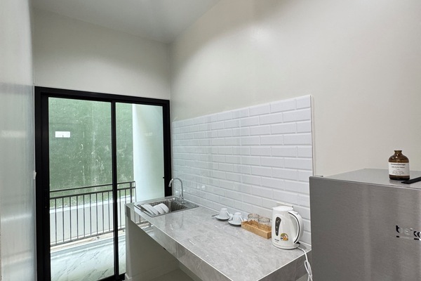 Quarto standard, varanda, vista para a lagoa | Cozinha privada | Chaleira elétrica