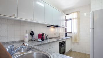 Apartamento, Vista para a cidade | Cozinha privada