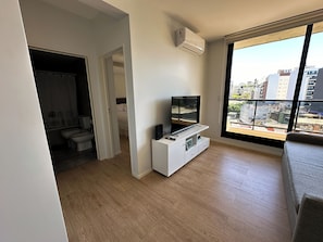 Apartamento, vista para a cidade | Área de estar