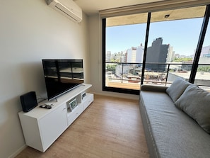 Apartamento, vista para a cidade | Área de estar