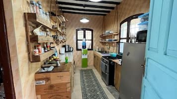 Quarto Deluxe, vista para o mar | Cozinha privada