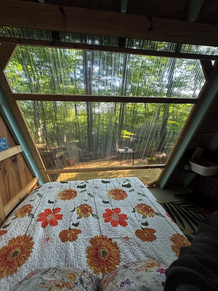 Charming A-frame cabin set in the woods overlooking deep wooded ravines ...