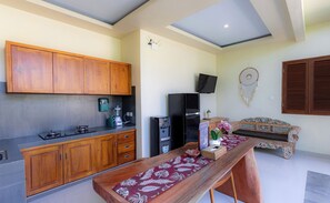 Quarto Deluxe | Cozinha privada | Uma chaleira elétrica