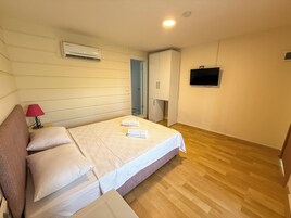 Quarto casal | Roupas de cama premium, frigobar, Wi-Fi de cortesia, roupa de cama