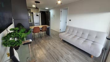 Apartamento | Sala de estar | TV de ecrã plano