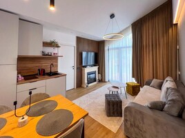 Casa de Campo Deluxe, vista para o vale | Sala de estar | Smart TV de 138 cm com canais digitais 