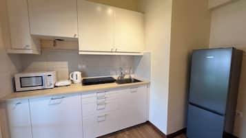 Apartamento, Vista para a cidade | Cozinha privada