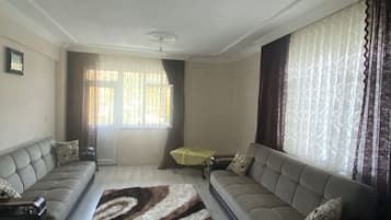 Apartamento Deluxe, varanda, vista para a montanha | Sala de estar