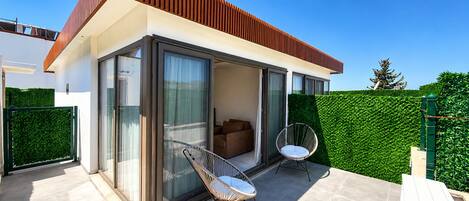 Quarto triplo luxo | Terraço/pátio