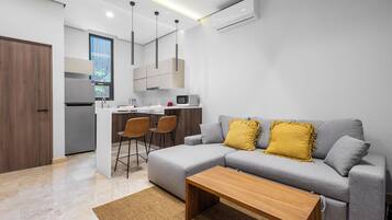 Apartamento Superior, vista para o jardim | Sala de estar