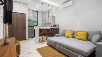 Apartamento Superior, vista para o jardim | Sala de estar