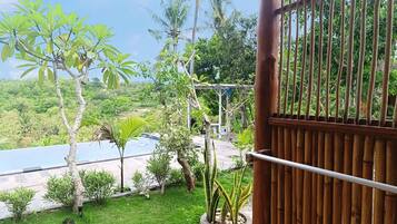 Quarto Duplo Deluxe, varanda, vista para o jardim | Vista para o jardim