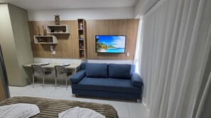 Apartamento conforto, vista para o pátio | Área de estar