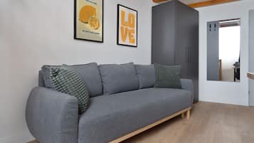Apartamento superior, 1 cama Queen e sofá-cama | Área de estar