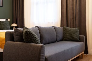 Estúdio Deluxe, 1 cama queen-size e sofá-cama | Sala de estar