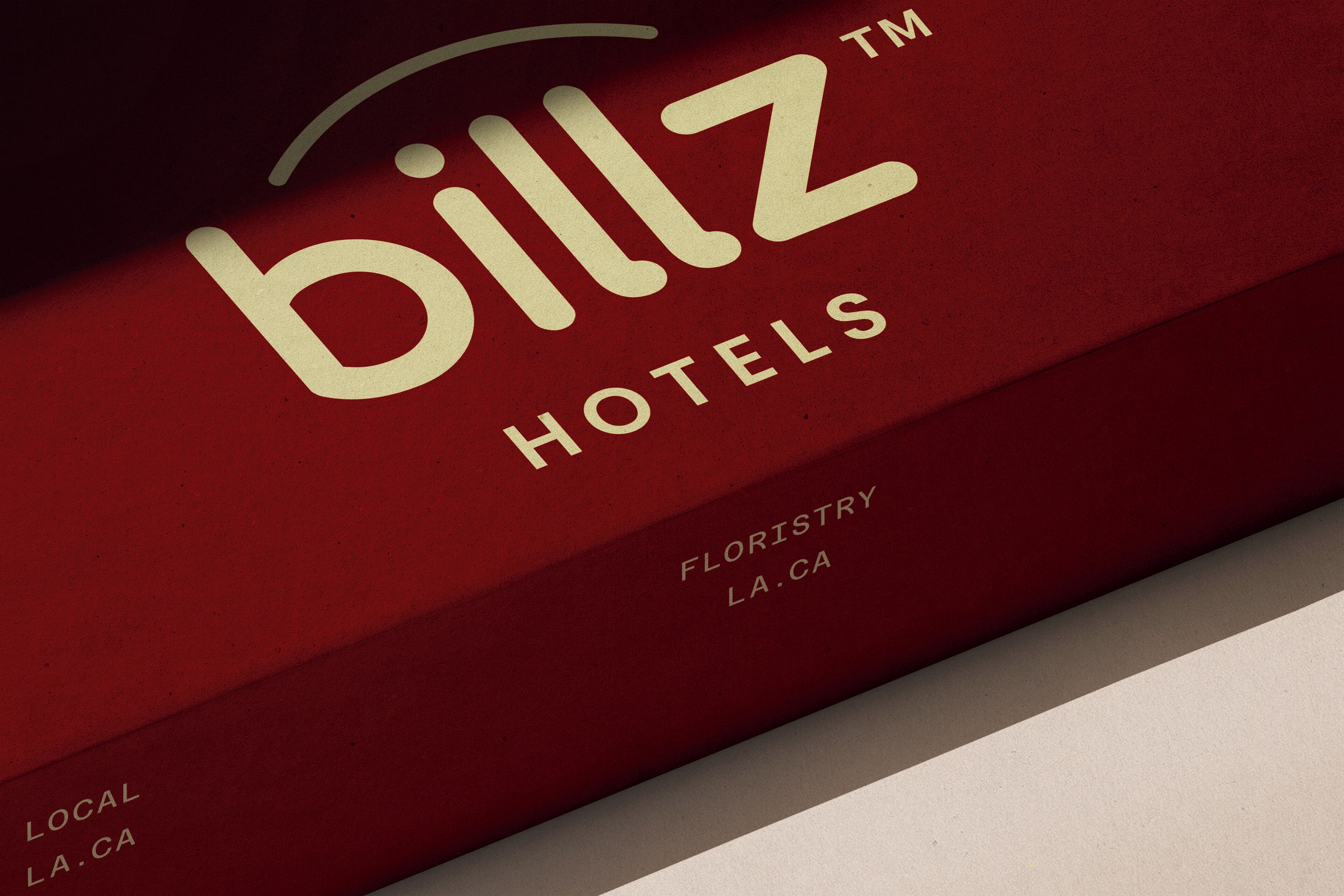 Um letreiro vermelho de hotel com o nome 'billz hotels' e a localização 'floristry LA, CA'.