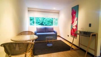 Quarto quádruplo luxo, vista para o jardim | Vista do quarto