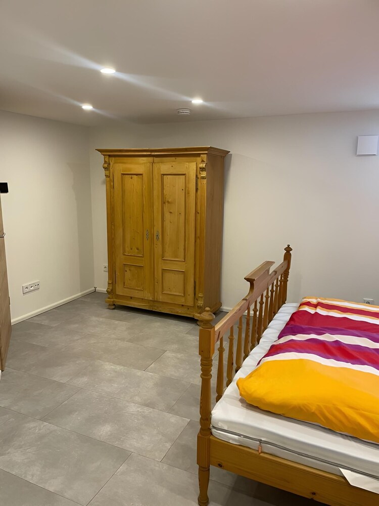 Cozy basement apartment with spacious living room and green outdoor ...