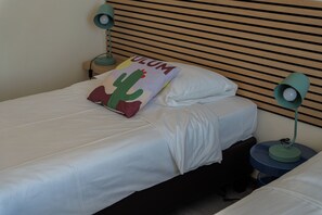 Roupas de cama premium, quartos à prova de som, Wi-Fi de cortesia