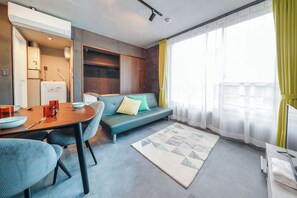 Apartamento, não fumadores (A(3p)) | Sala de estar | TV de ecrã plano 