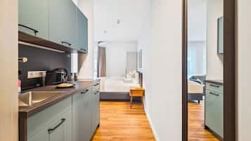 Suíte conforto, 1 cama Queen e sofá-cama | Cozinha privada | Máquina de café expresso, chaleira elétrica, torradeira