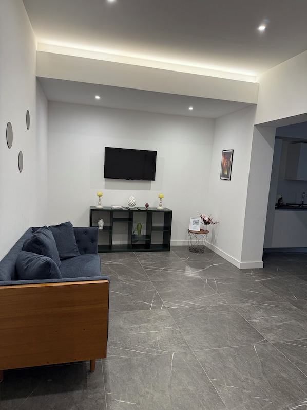 Apartamento Deluxe, Vista para a cidade | Sala de estar