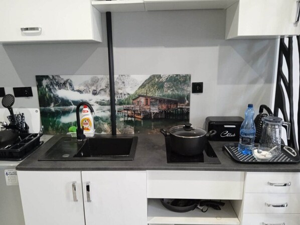 Suíte família, vista para a cidade | Cozinha americana privada