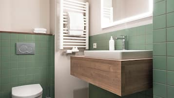 Quarto casal básico | Banheiro | Chuveiro, secador de cabelo, toalhas de banho, sabonete