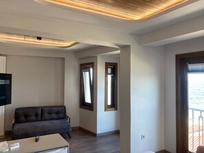 Quarto Triplo Familiar, vista para o mar | Roupa de cama fornecida