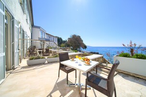 Suíte, terraço, vista para o mar | Terraço/pátio