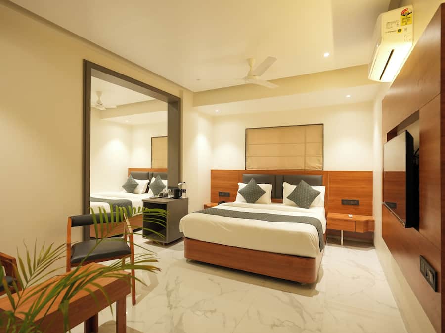 Quarto quádruplo luxo (A/C) | 1 quarto, frigobar, escrivaninha, ferros/tábuas de passar roupa