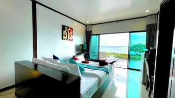 Quarto Deluxe, vista para o mar | Cofre no quarto, secretária, camas desdobráveis, Wi-fi grátis